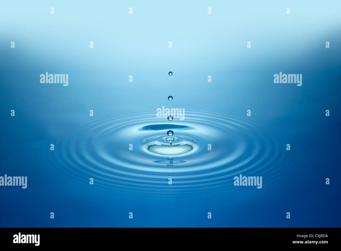 Water droplet and ripples Stock Photo - Alamy