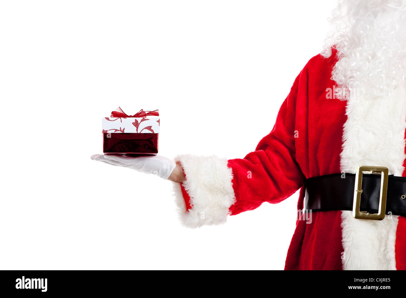 Santa Claus' hand holding out a red and white wrapped Christmas gift ...