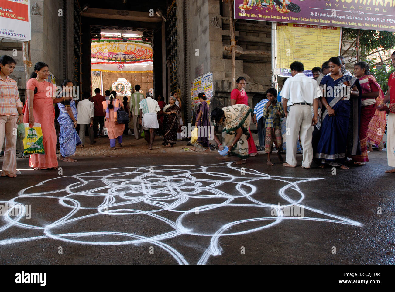 Making Kolam;Rangoli in front of kapaleeswarar temple during ...