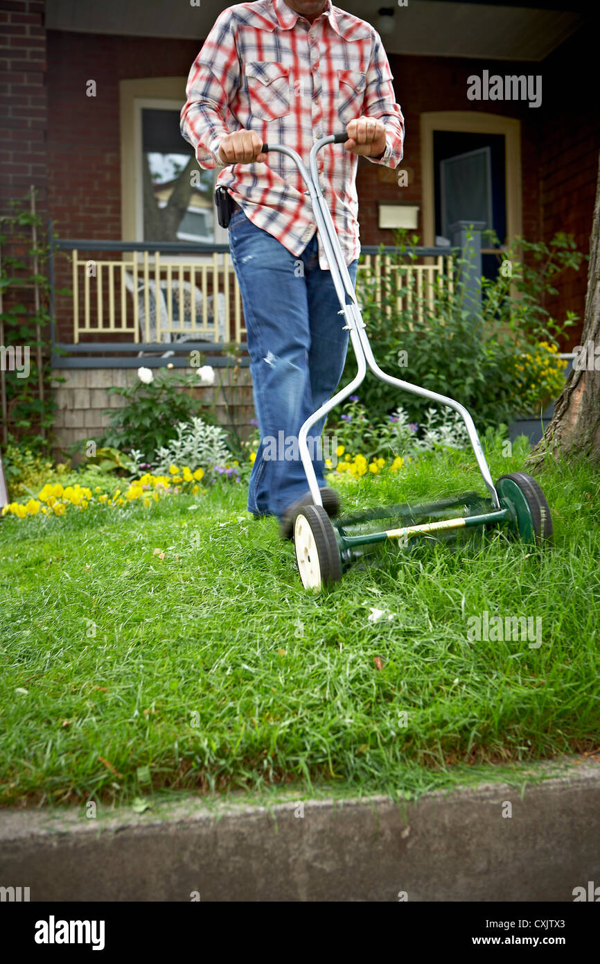 Man Cutting Grass, Toronto, Ontario, Canada Stock Photo - Alamy