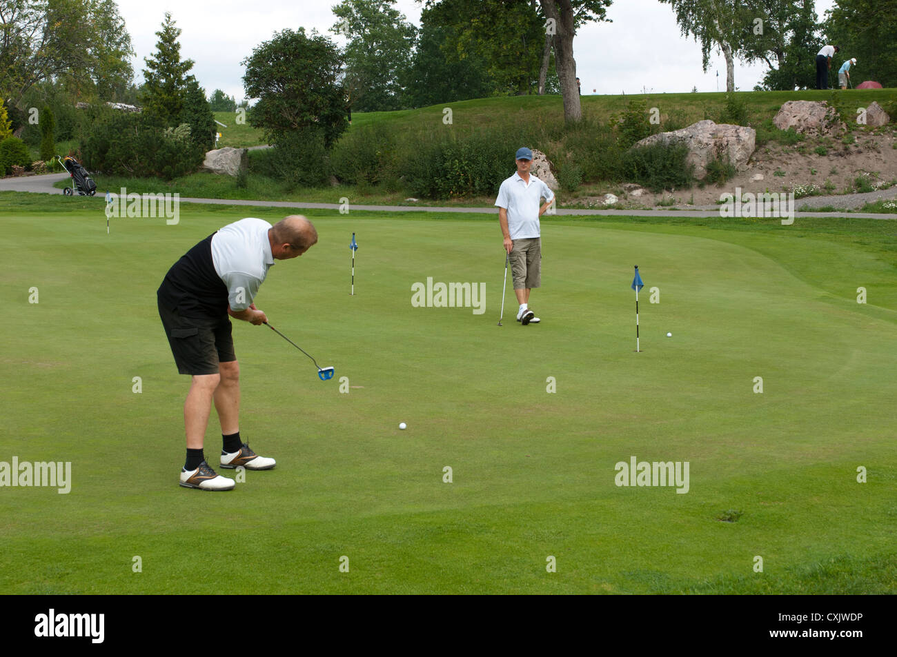 People play golf Stock Photo - Alamy