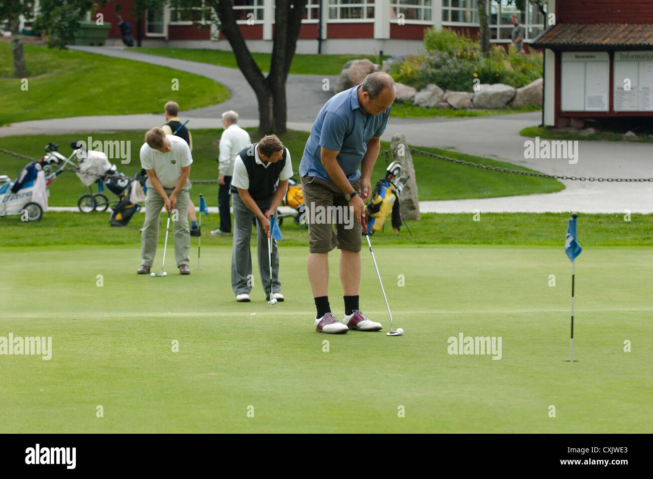 People play golf Stock Photo - Alamy