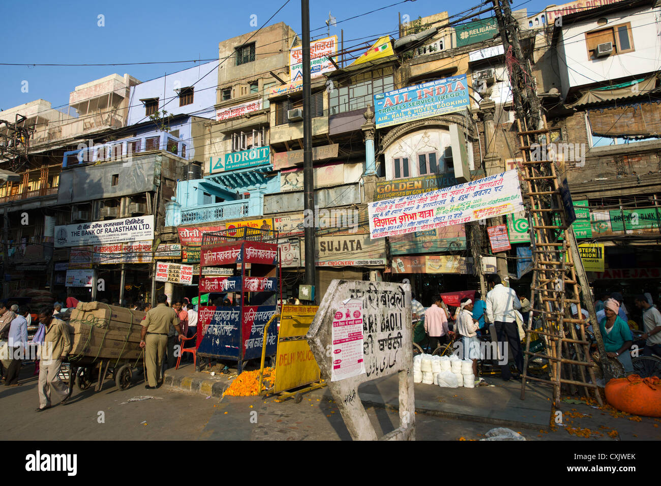 Bustling traffic and sign boards at the junction of Khari Baoli Road ...