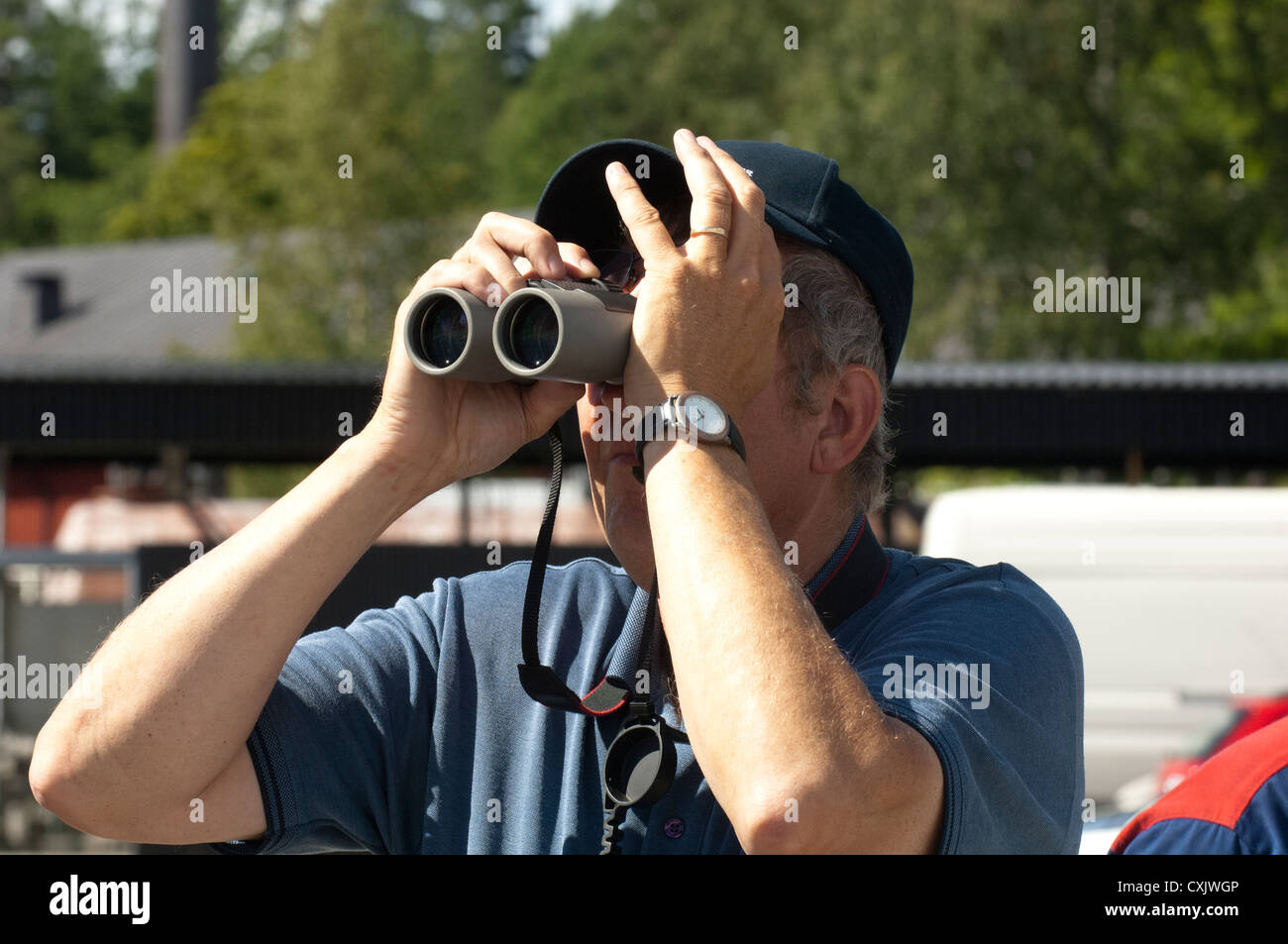 A man with his binoculars Stock Photo - Alamy