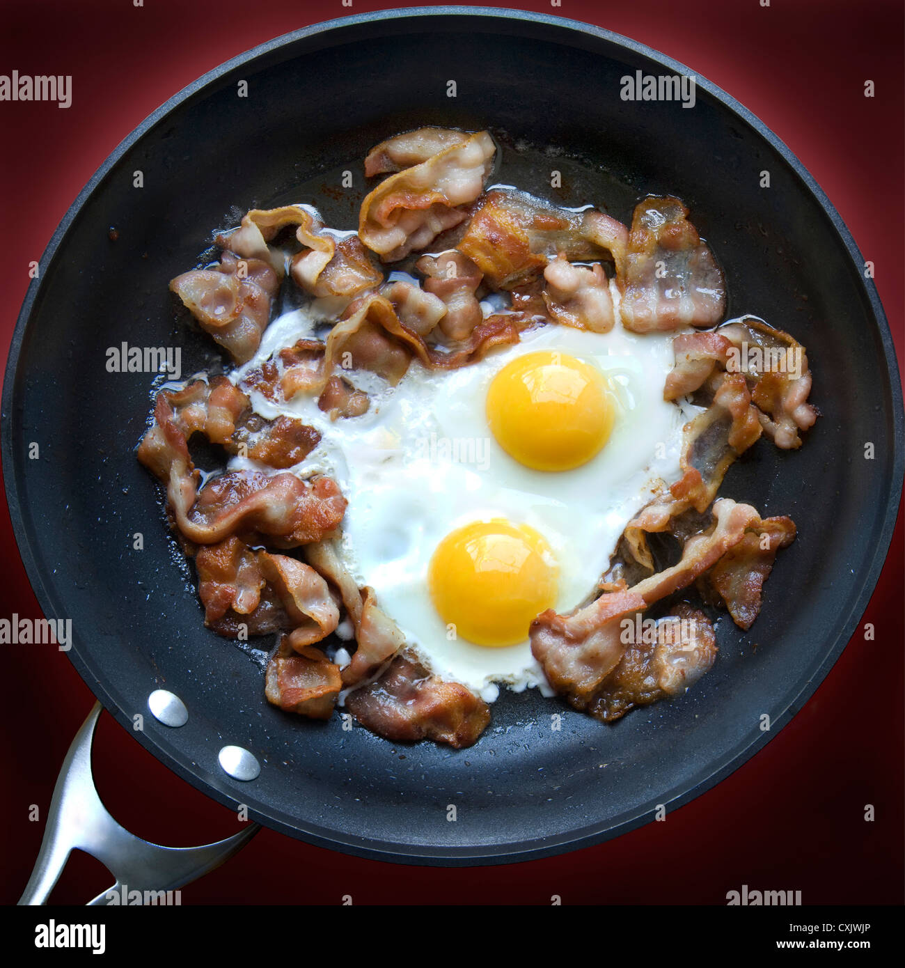 Bacon and Eggs in Frying Pan Stock Photo - Alamy Bacon and Eggs in Frying Pan Stock Photo - Alamy