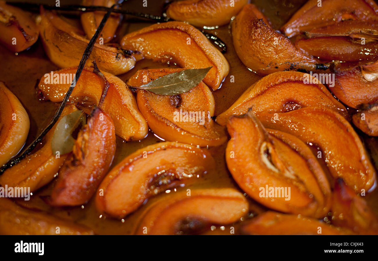 baked quince slices with bay leaves Stock Photo - Alamy