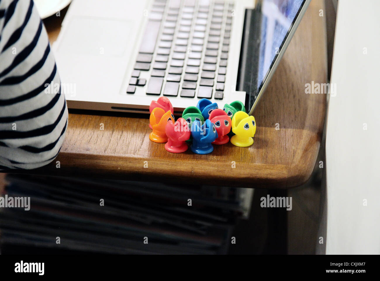 It's a photo of many little fish toys that are standing side by side ...