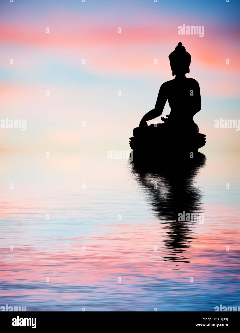 Silhouette of Buddha statue reflecting in rippling water Stock Photo ...