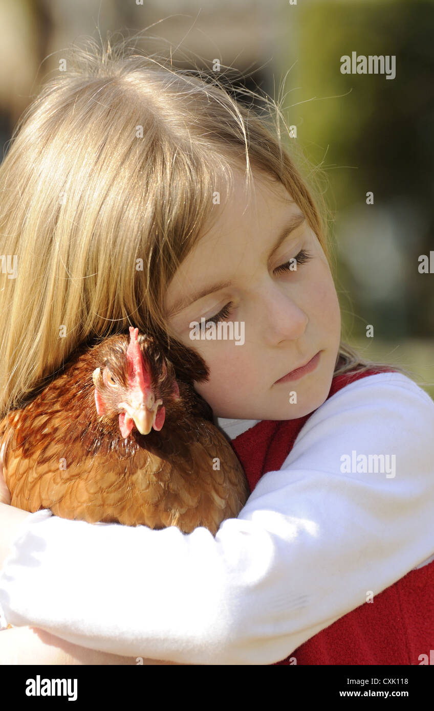 little girl hugging a chicken Stock Photo - Alamy
