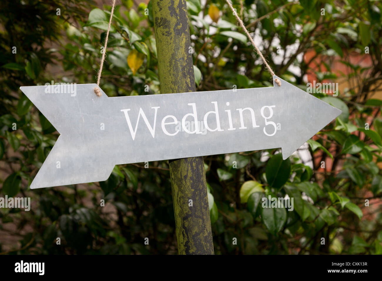 Arrow shaped Wedding sign Stock Photo - Alamy
