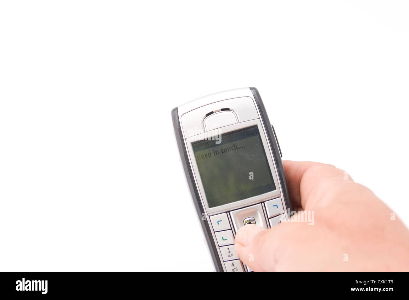 Texting the words keep in touch on mobile phone Stock Photo - Alamy