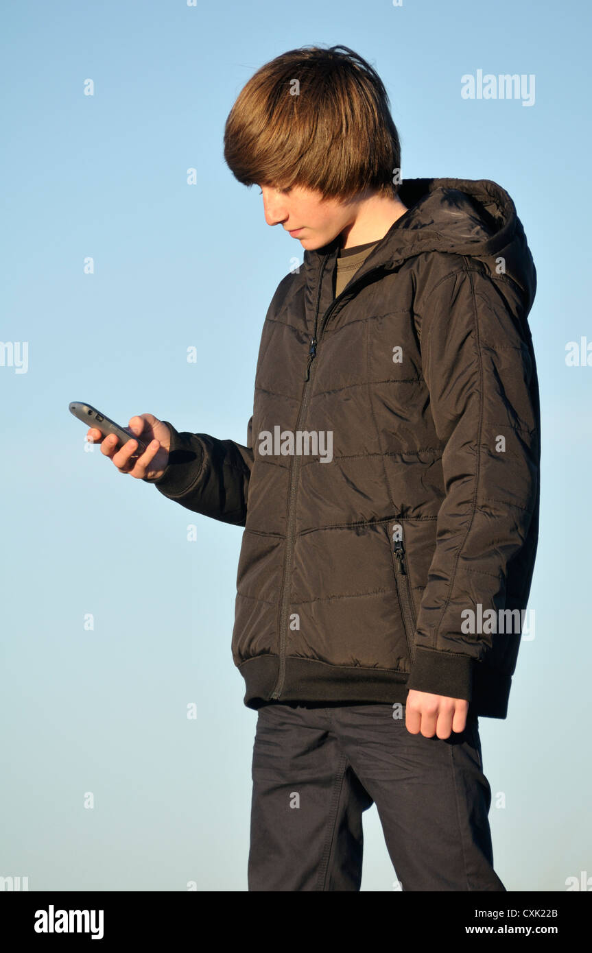Teenage Boy using Cell Phone, Rogues, France Stock Photo - Alamy
