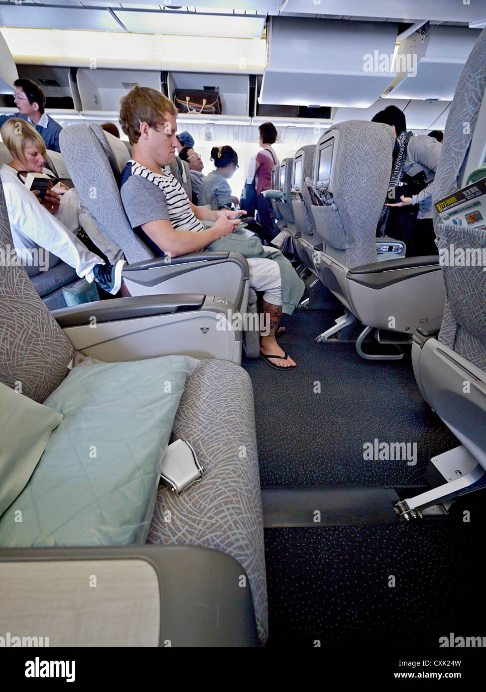 Plane seats leg room hi-res stock photography and images - Alamy