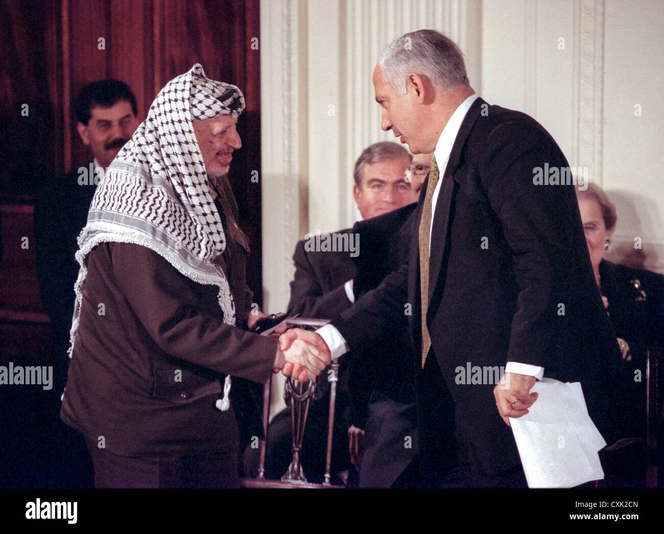 Palestinian Leader Yasser Arafat shakes hands with Israel Prime ...