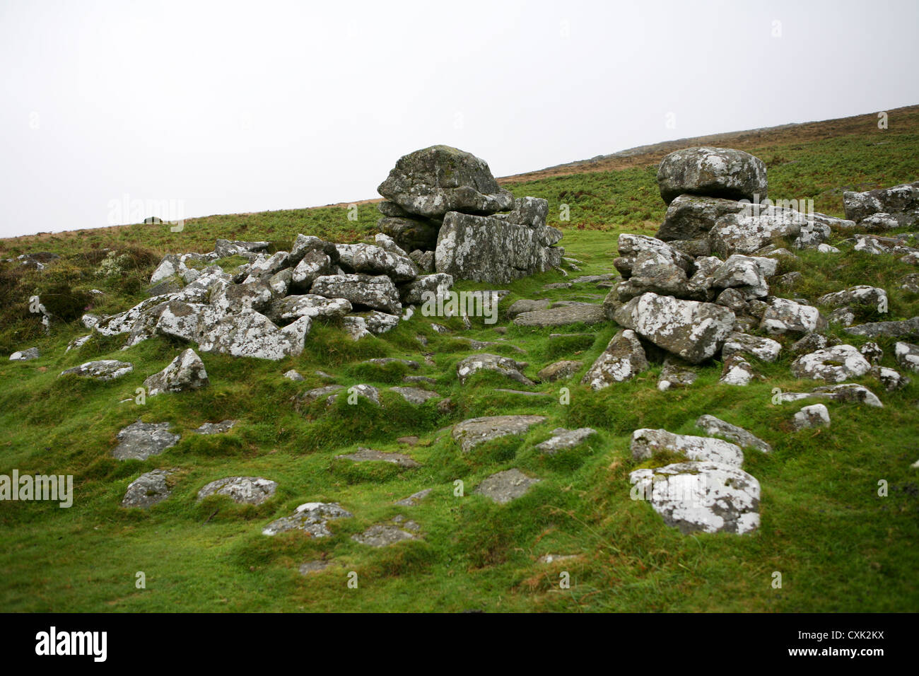 Stone wall enclosure entrance to Grimspound, a Bronze Age settlement in ...
