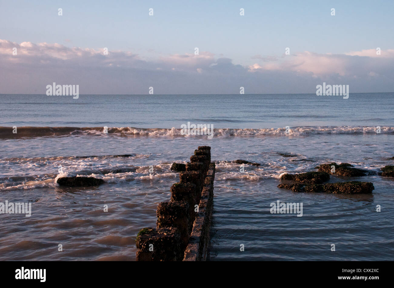 sunrise at the beach hastings Stock Photo - Alamy