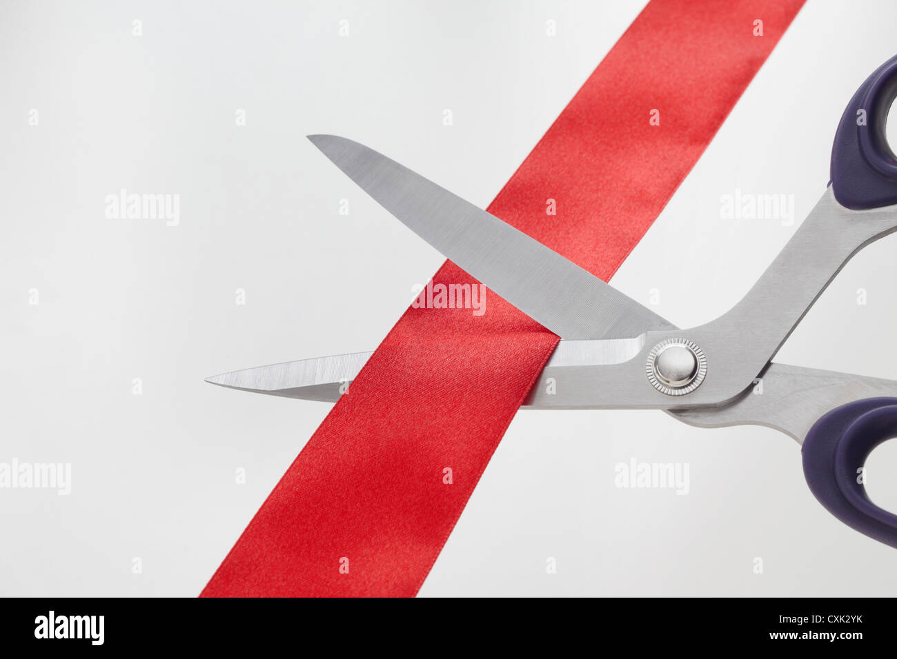 Scissors Cutting Red Ribbon Stock Photo - Alamy