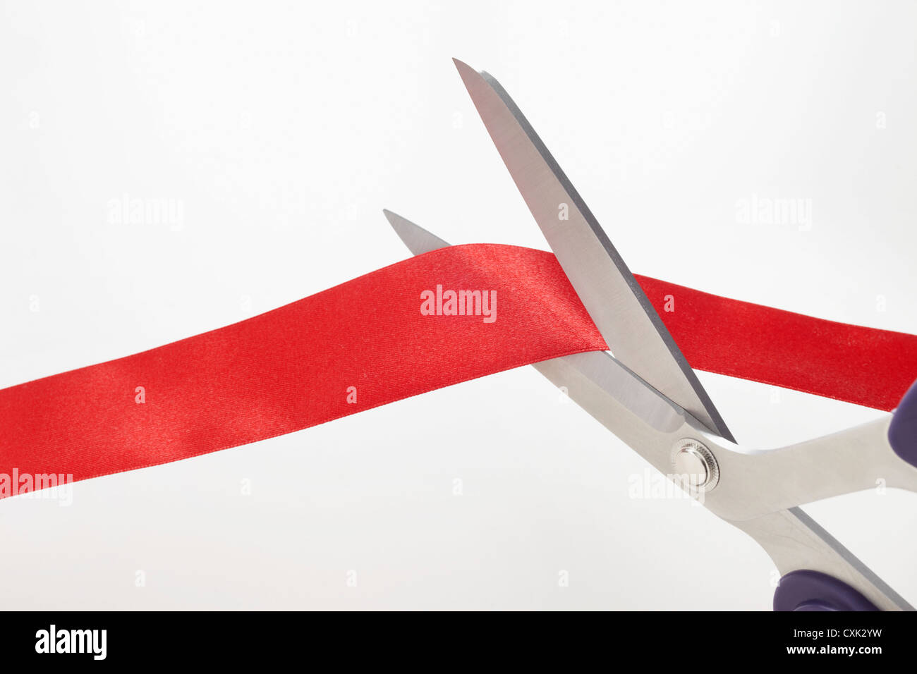 Scissors Cutting Red Ribbon Stock Photo - Alamy