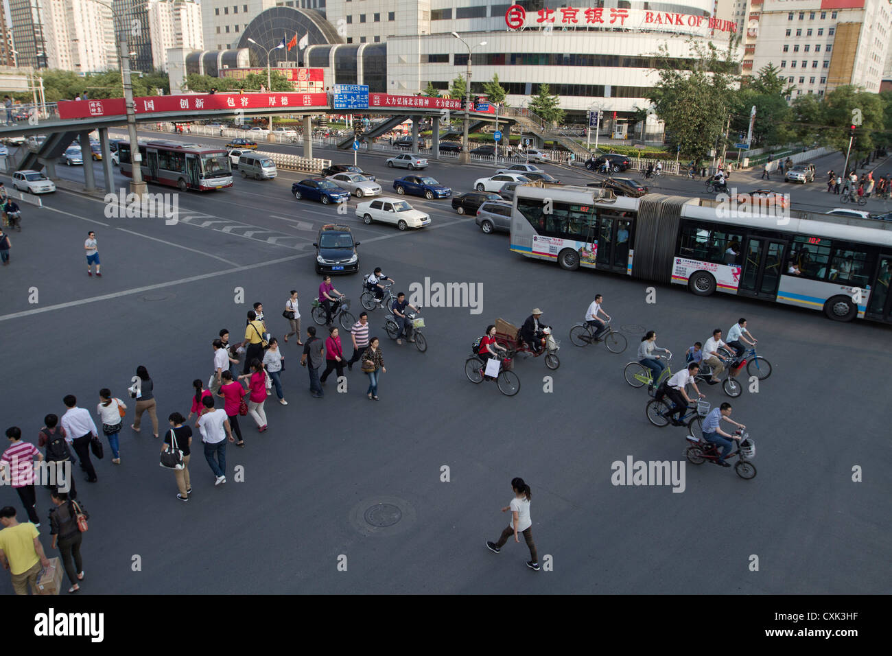 Traffic and pedestrians at an intersection in Fuchengmen, central ...