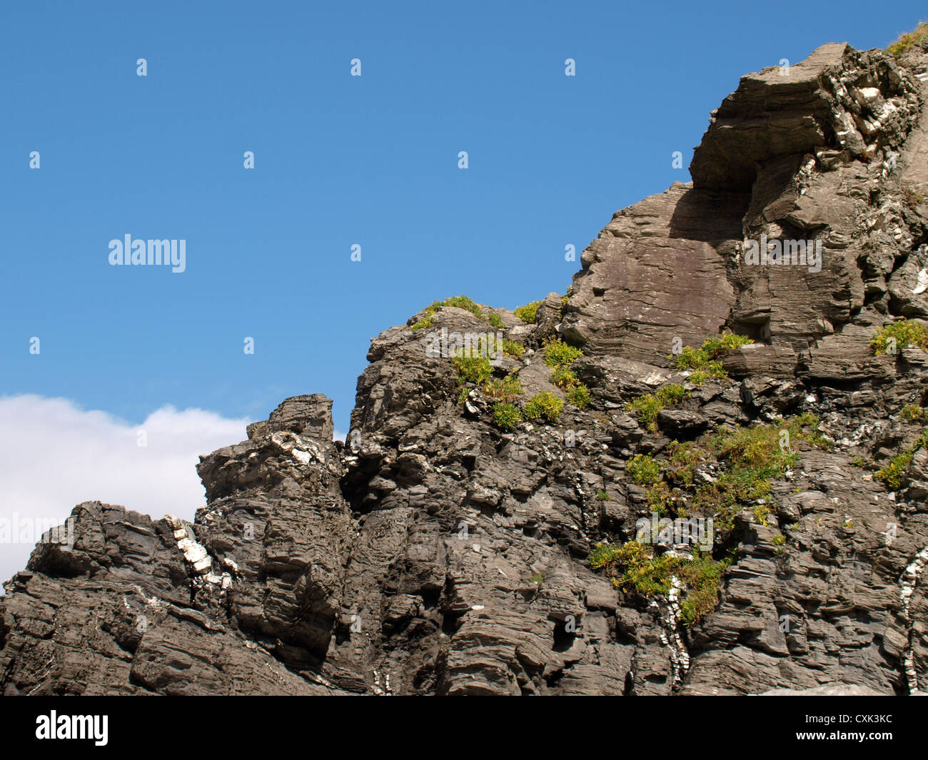 Cliffs with blue sky, Watergate Bay, Cornwall, UK Stock Photo - Alamy