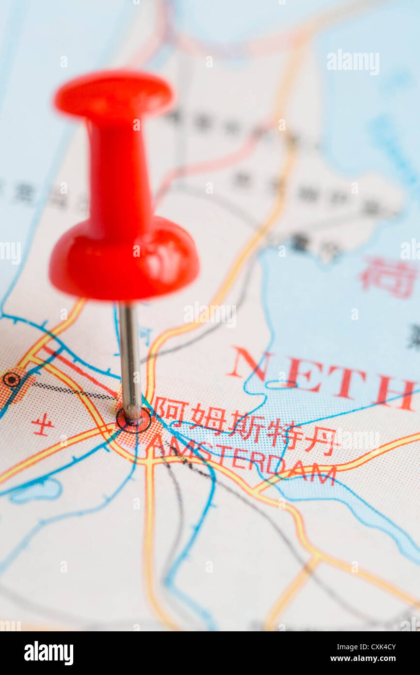 Thumbtack stuck in the map Stock Photo - Alamy