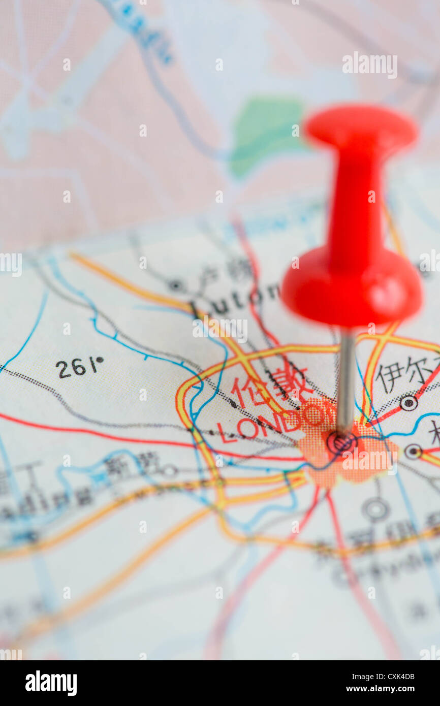 Thumbtack stuck in the map Stock Photo - Alamy