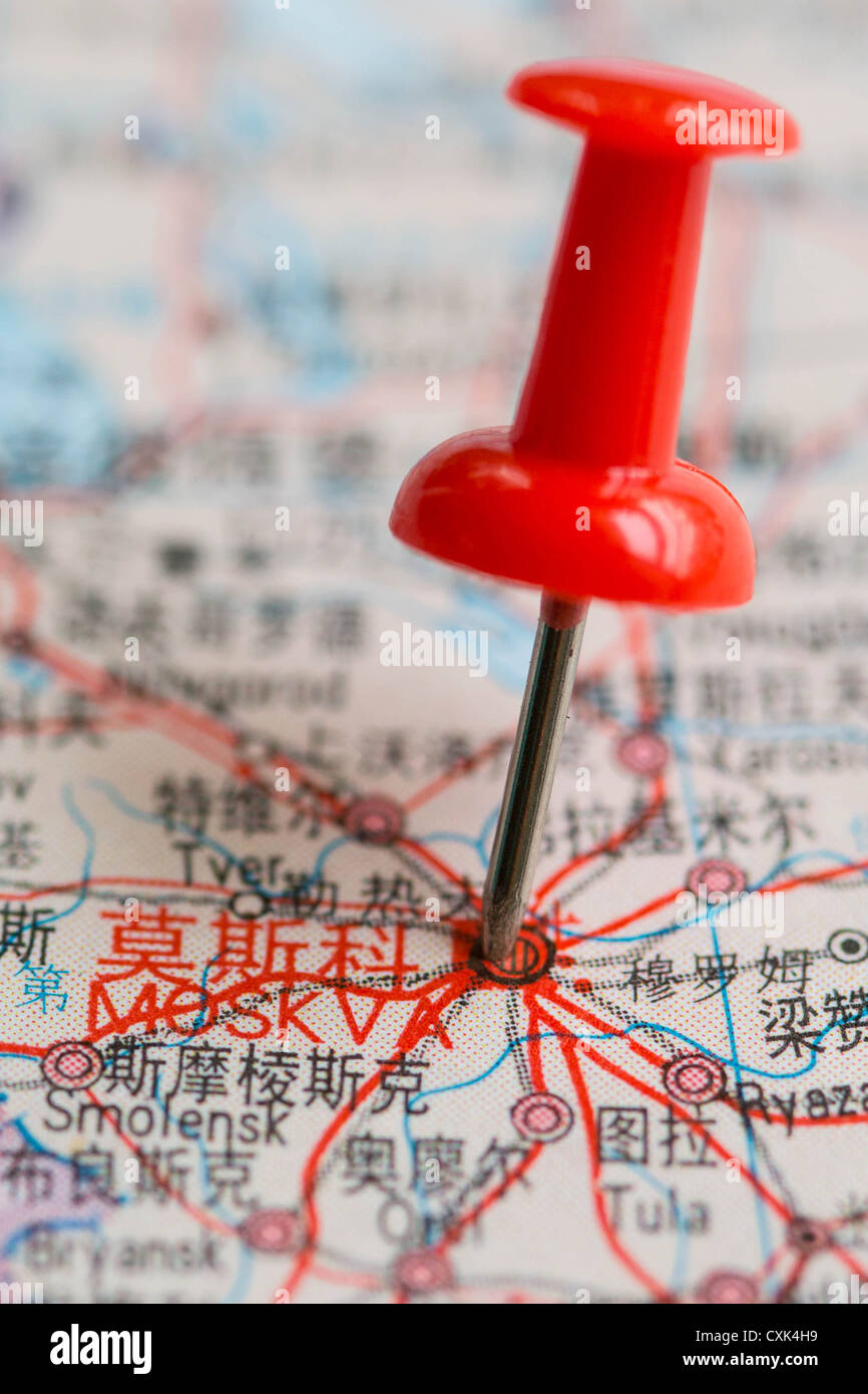 Thumbtack stuck in the map Stock Photo - Alamy