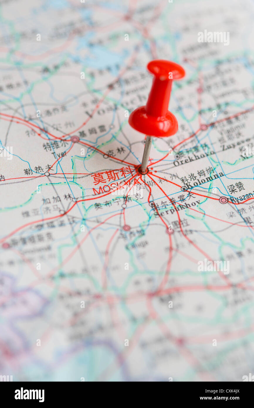 Thumbtack stuck in the map Stock Photo - Alamy