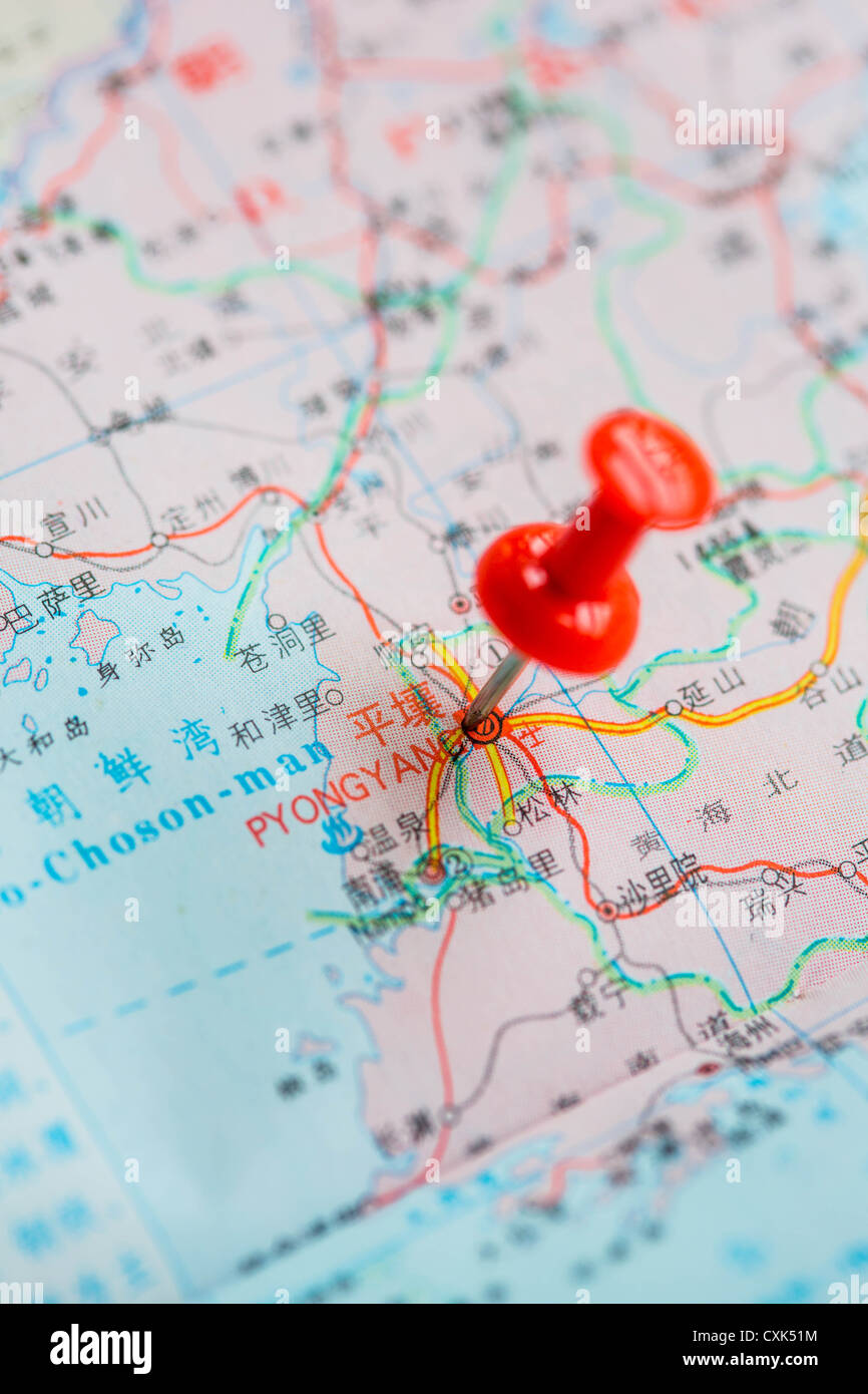 Thumbtack stuck in the map Stock Photo - Alamy