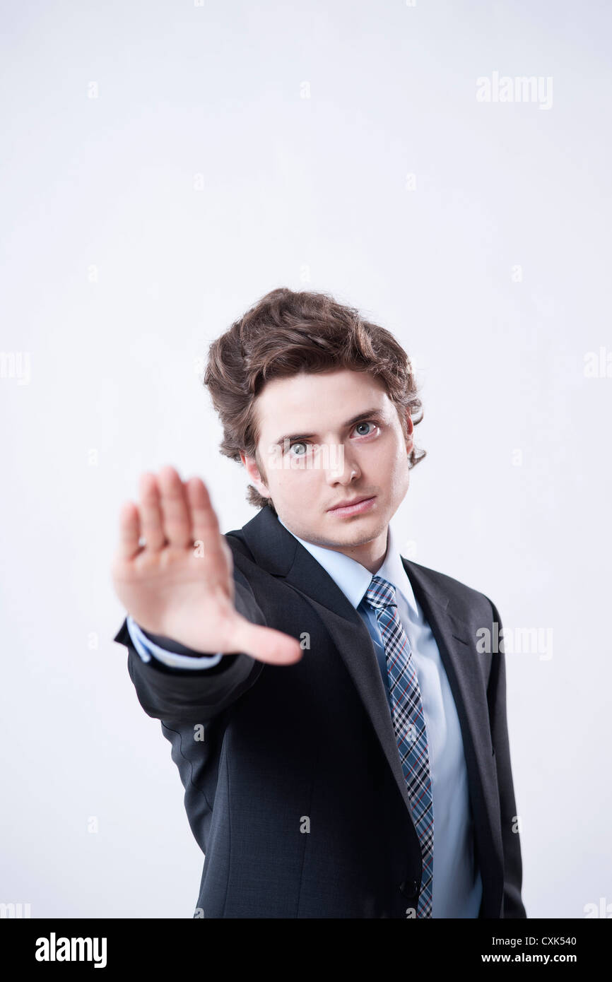 Portrait of Young Businessman using Hand Gesture Stock Photo - Alamy