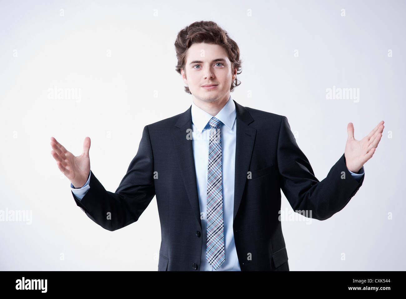 Portrait of Young Businessman using Hand Gesture Stock Photo - Alamy