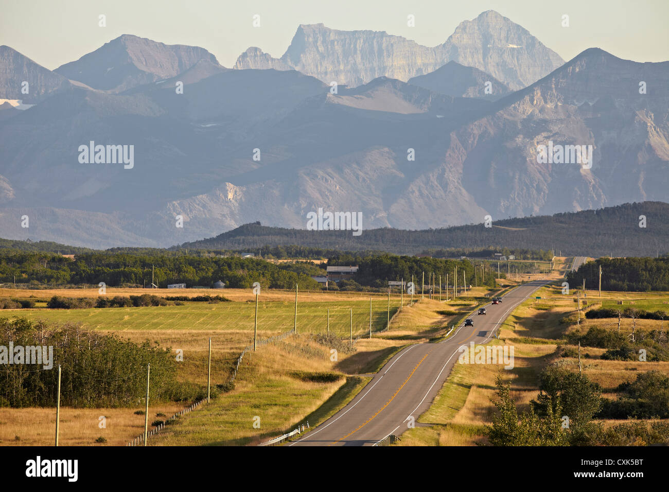 Rural Road and Rocky Mountains, Pincher Creek, Alberta, Canada Stock ...
