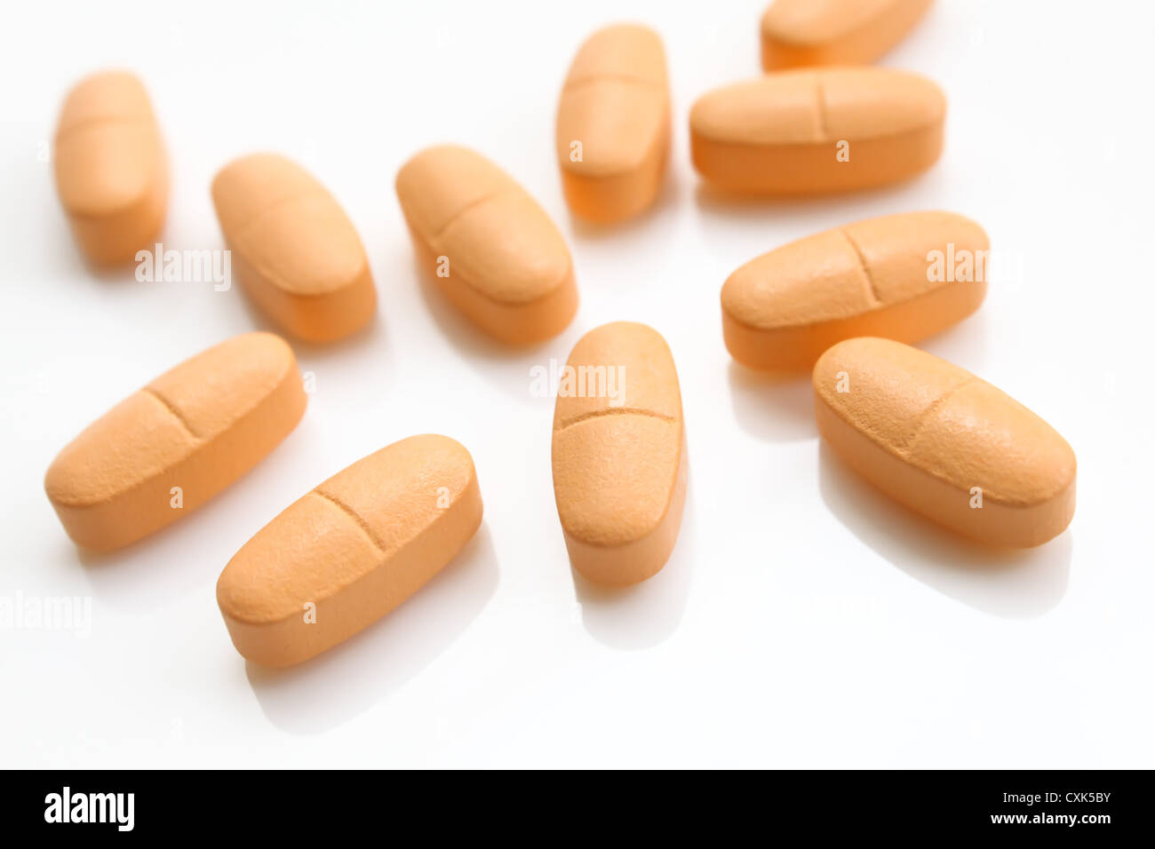 Isolated orange pills Cut Out Stock Images & Pictures - Alamy