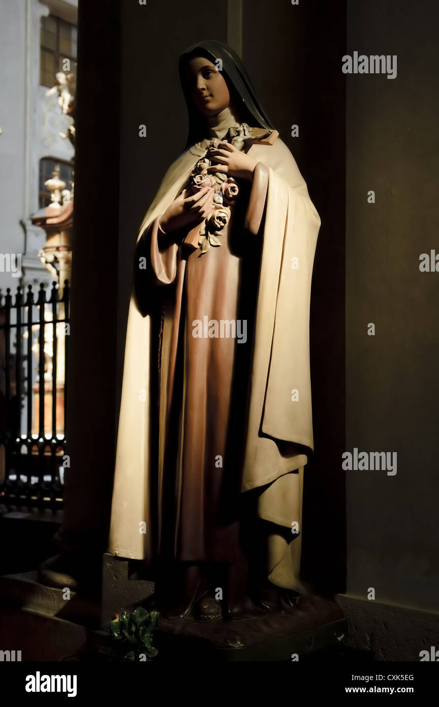 Woman's statue in the catholic church Stock Photo - Alamy