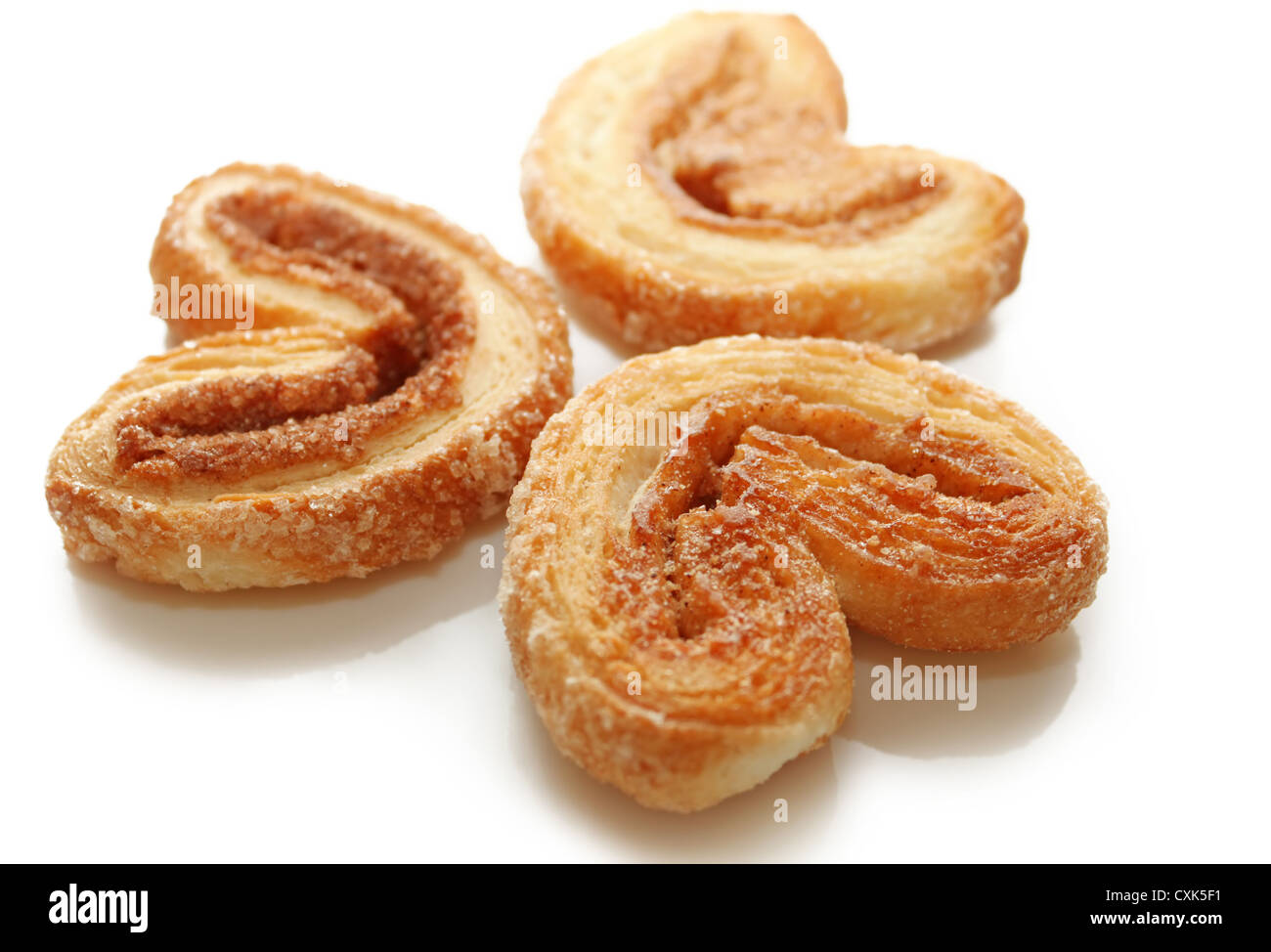 Three sweet cookies with cinnamon Stock Photo - Alamy
