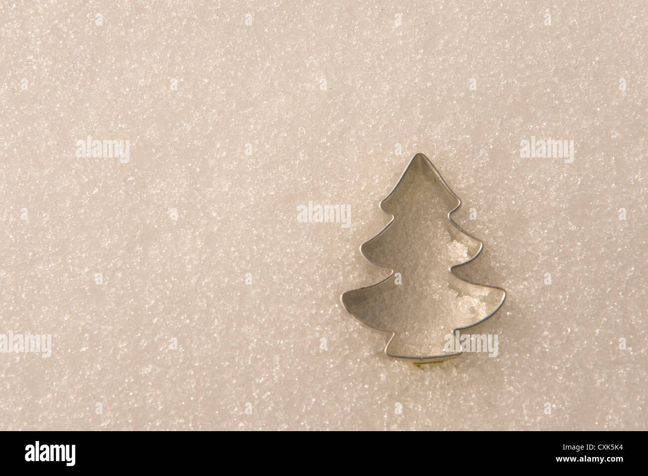 Tree-Shaped Cookie Cutter in Snow Stock Photo - Alamy