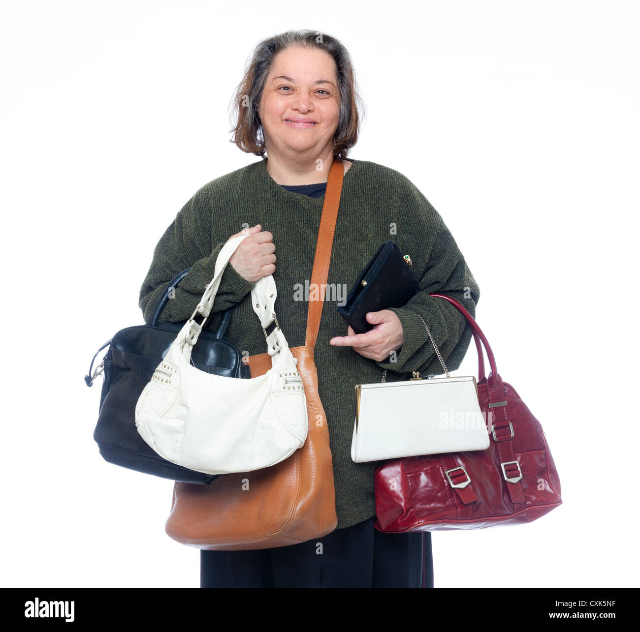 A middle aged woman poses with a bunch of purses and ladies and women's ...