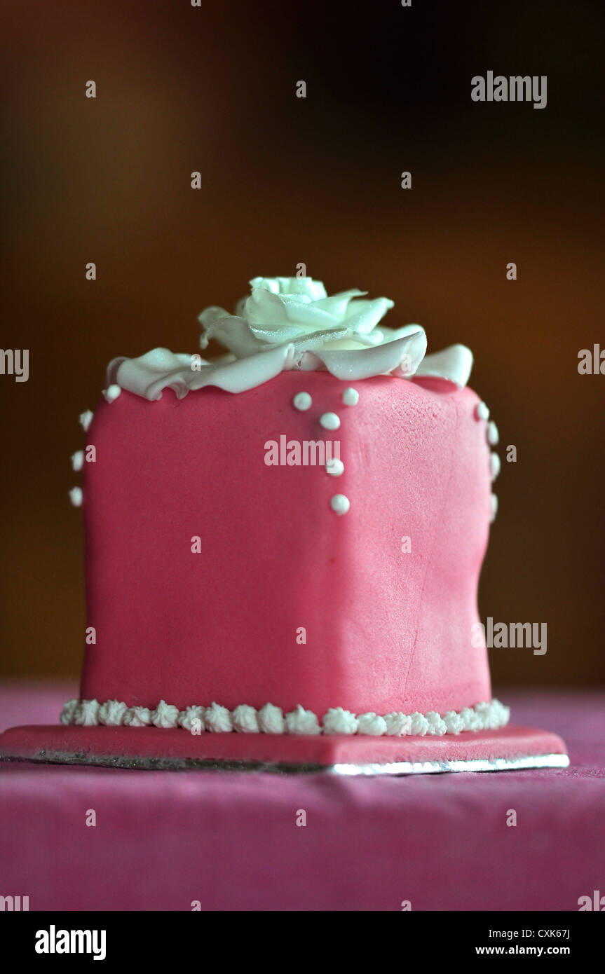 A small pink cake beautifully decorated UK Stock Photo - Alamy
