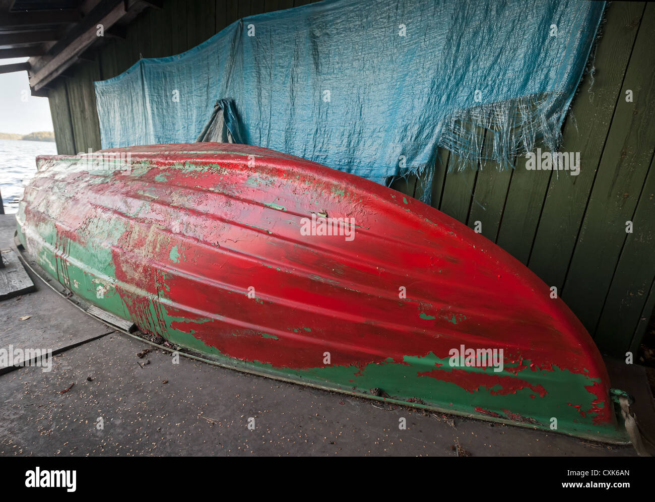Old rowing fishing boat inverted on the coast under renovation Stock ...