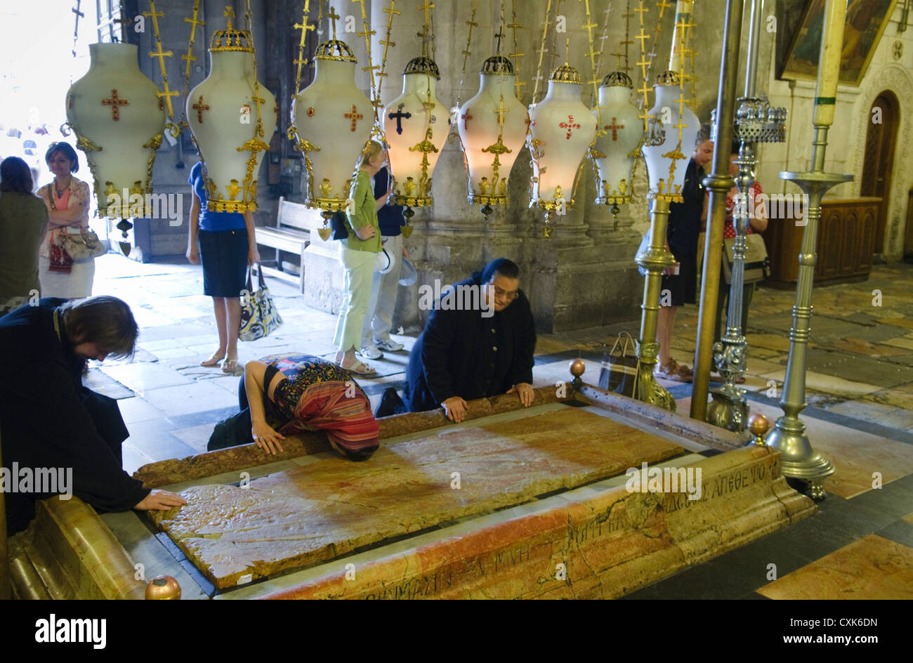 pilgrims at the Stone of Anointing in the Church of the Holy Sepulchre ...