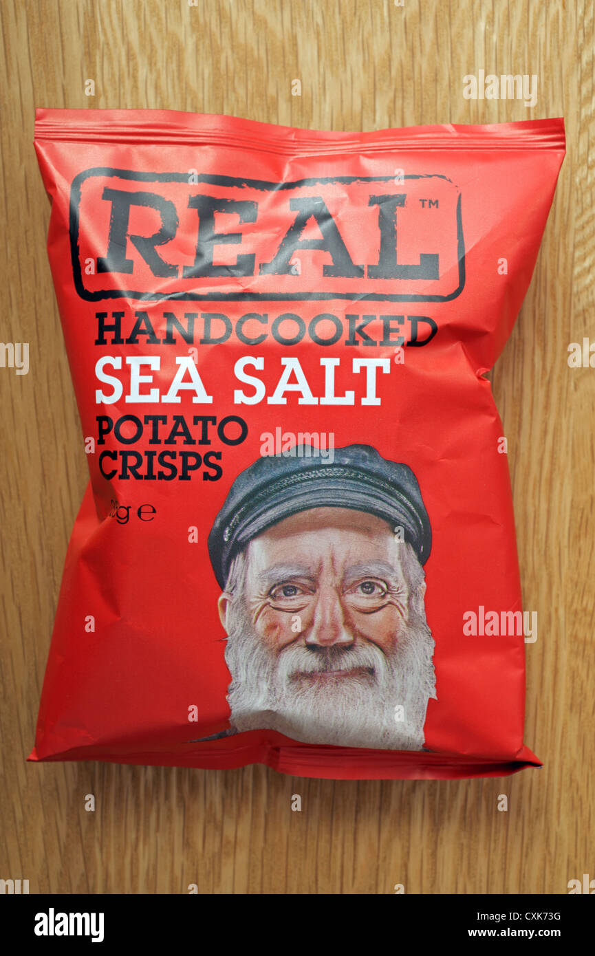 Real hand cooked sea salt potato crisps Stock Photo - Alamy