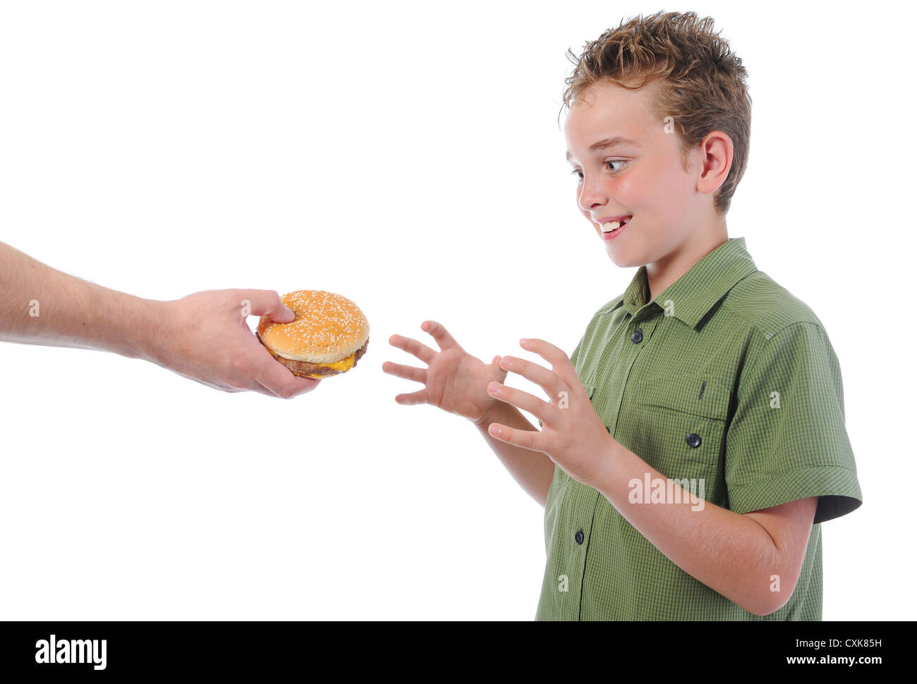 Little boy eating a hamburger Stock Photo - Alamy