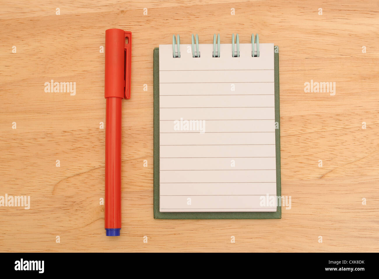 Note pad and pen Stock Photo - Alamy