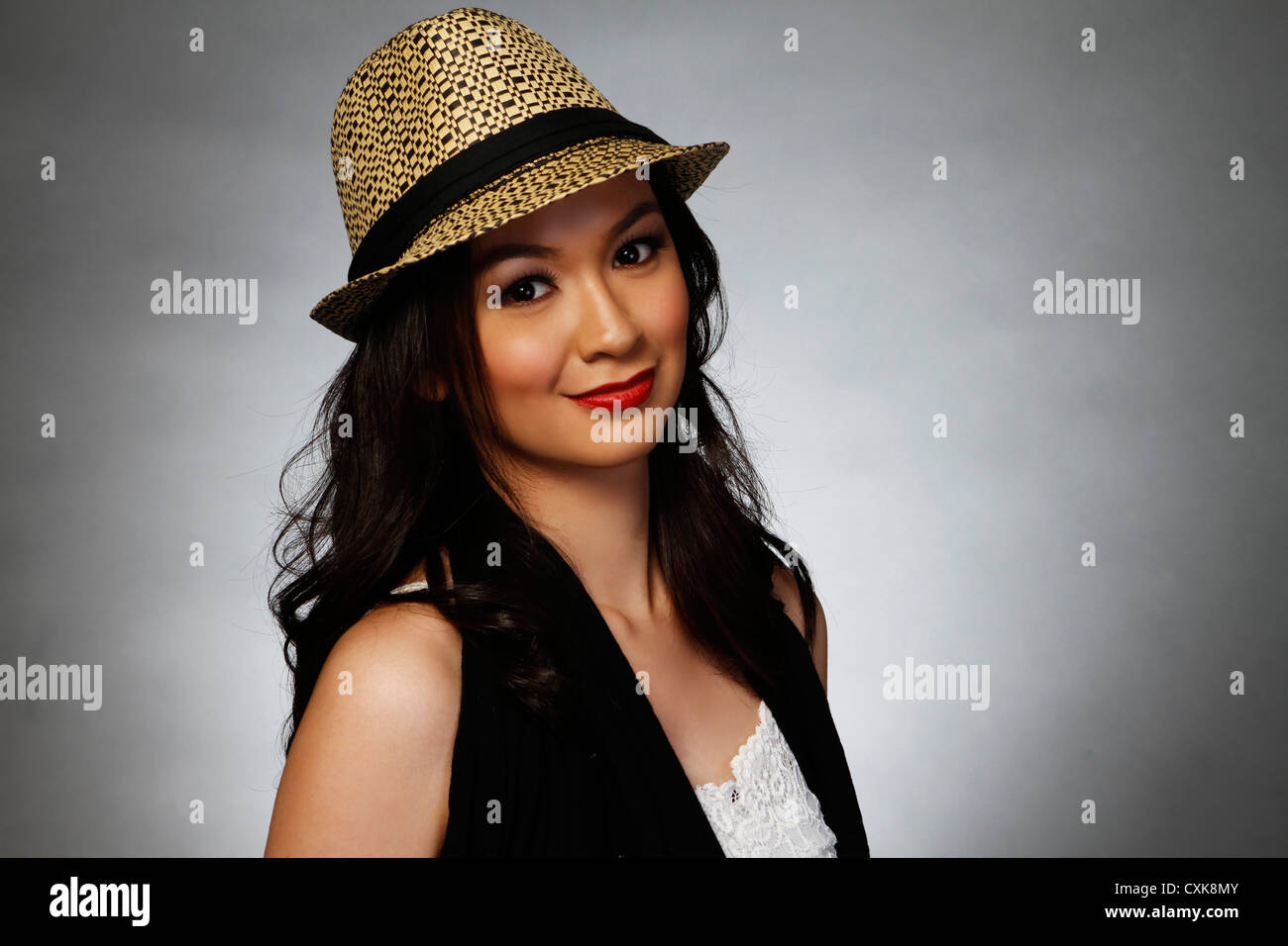 An attractive young woman in dramatic studio lighting Stock Photo - Alamy