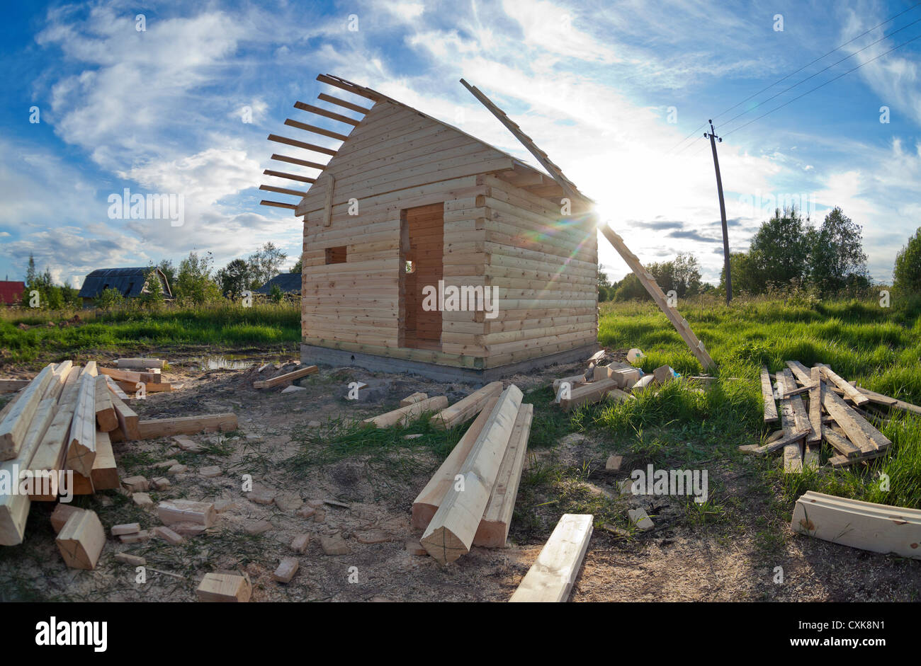 Wooden house under construction Stock Photo - Alamy