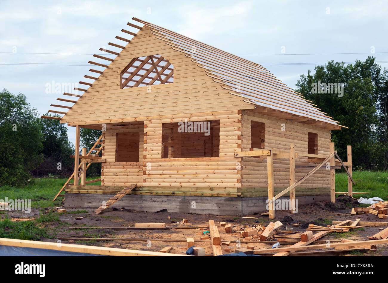 Wooden house under construction Stock Photo - Alamy