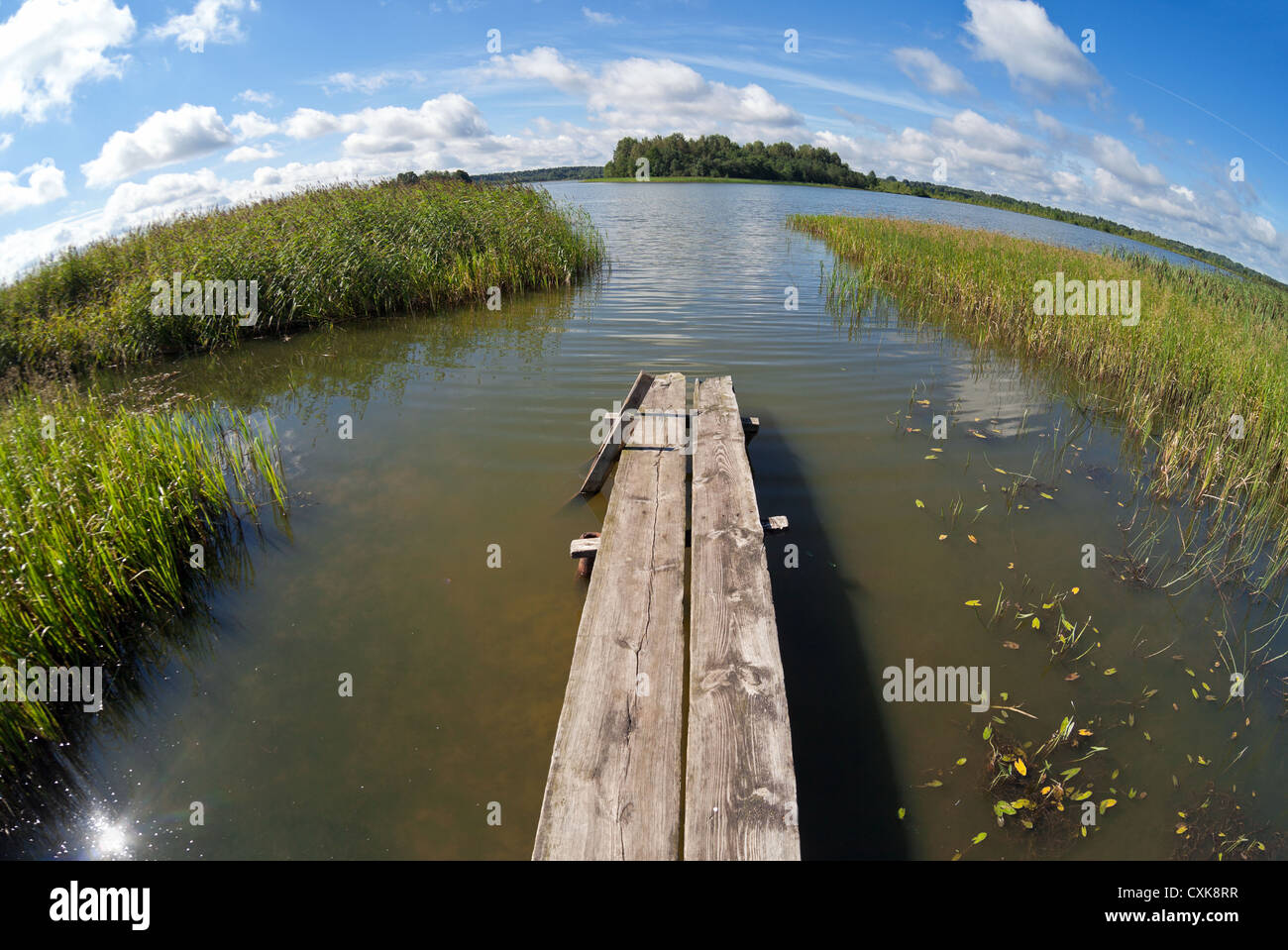 Summer landscape with lake and wooden bridge Stock Photo - Alamy