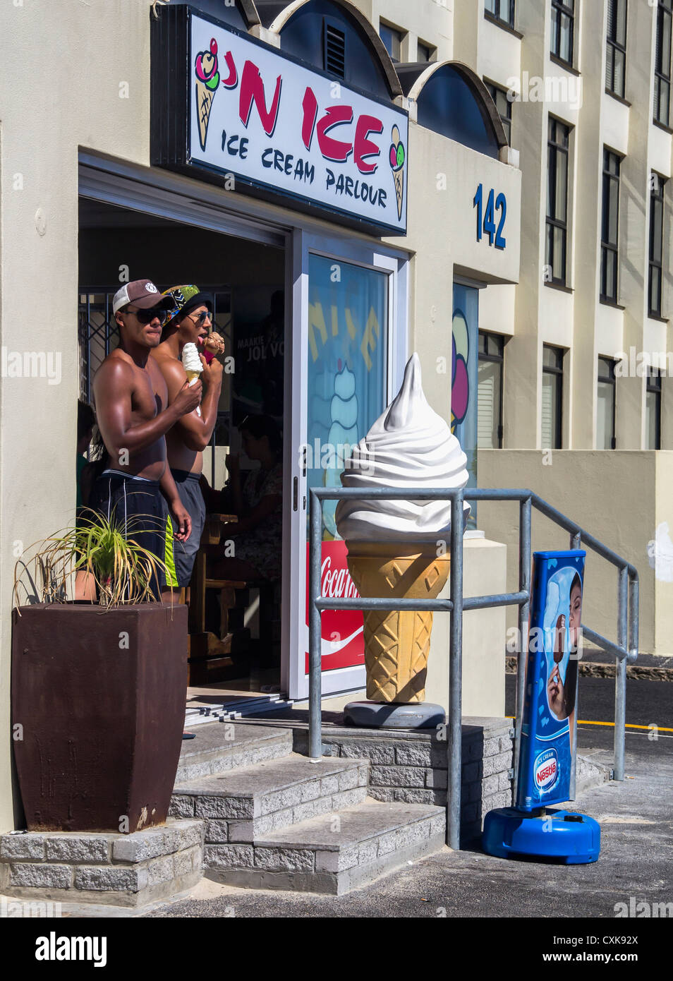 Two men eating ice cream at an Ice Cream Parlour - the Strand, Western ...