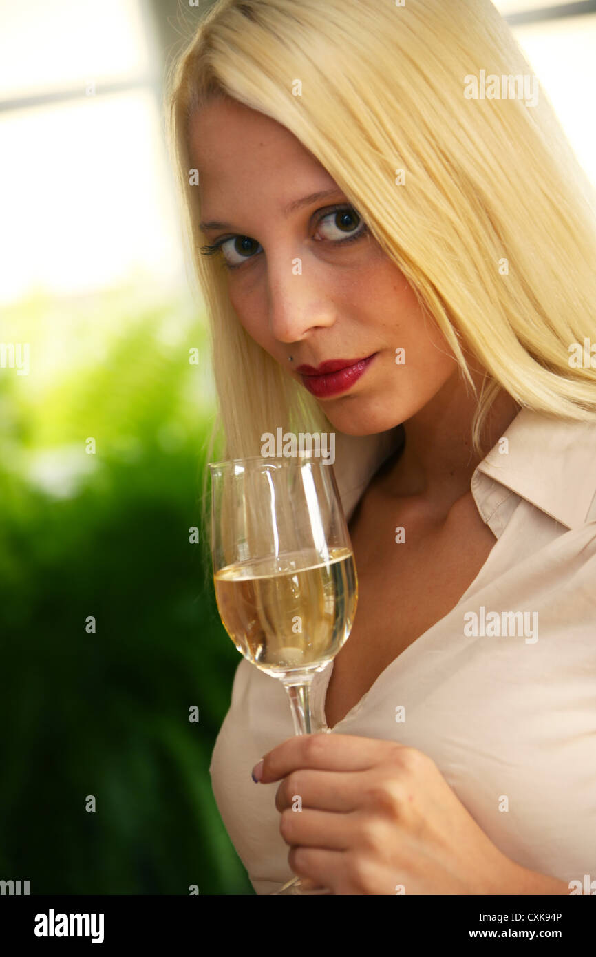 Woman with white wine Stock Photo - Alamy