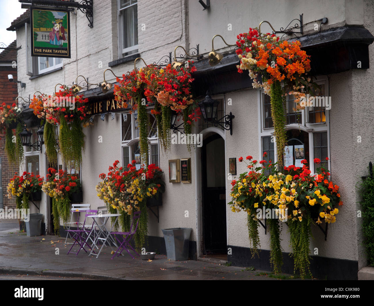 Hanging baskets,laden with flowers,outside a pub in Chichester Stock ...